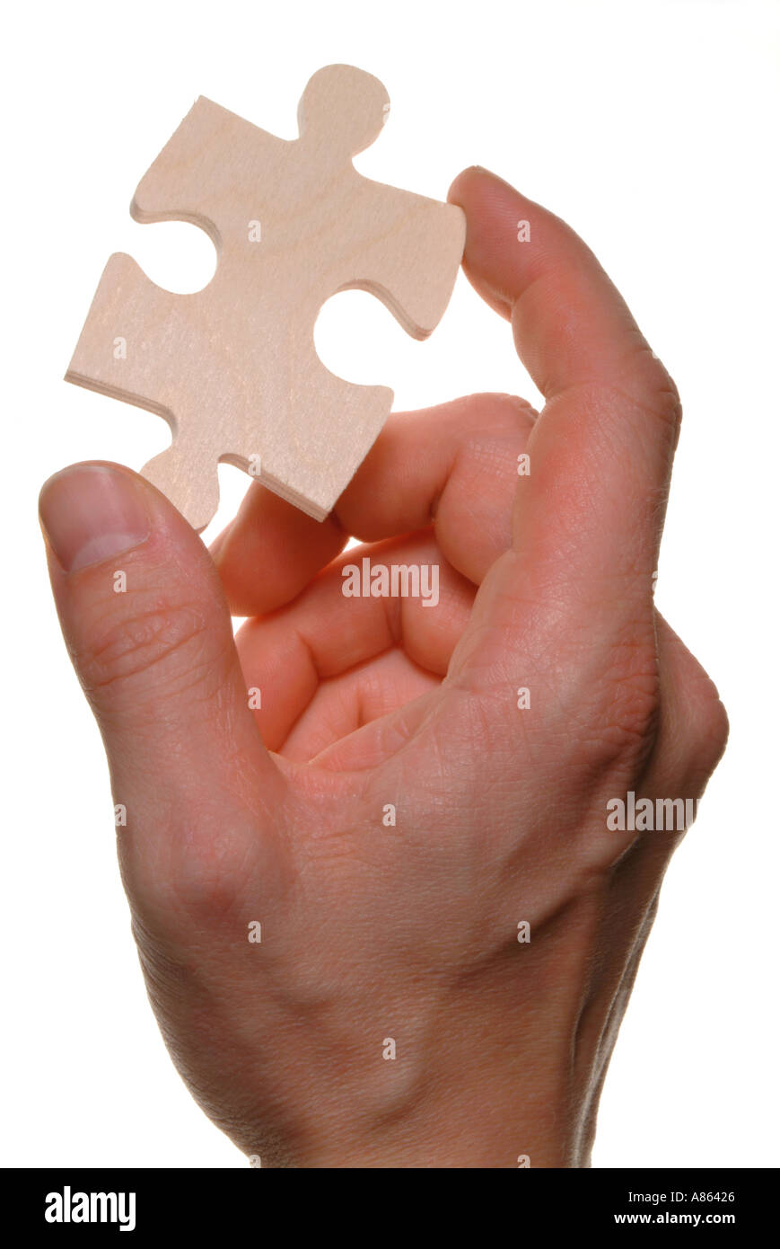Jigsaw piece hand hi-res stock photography and images - Alamy