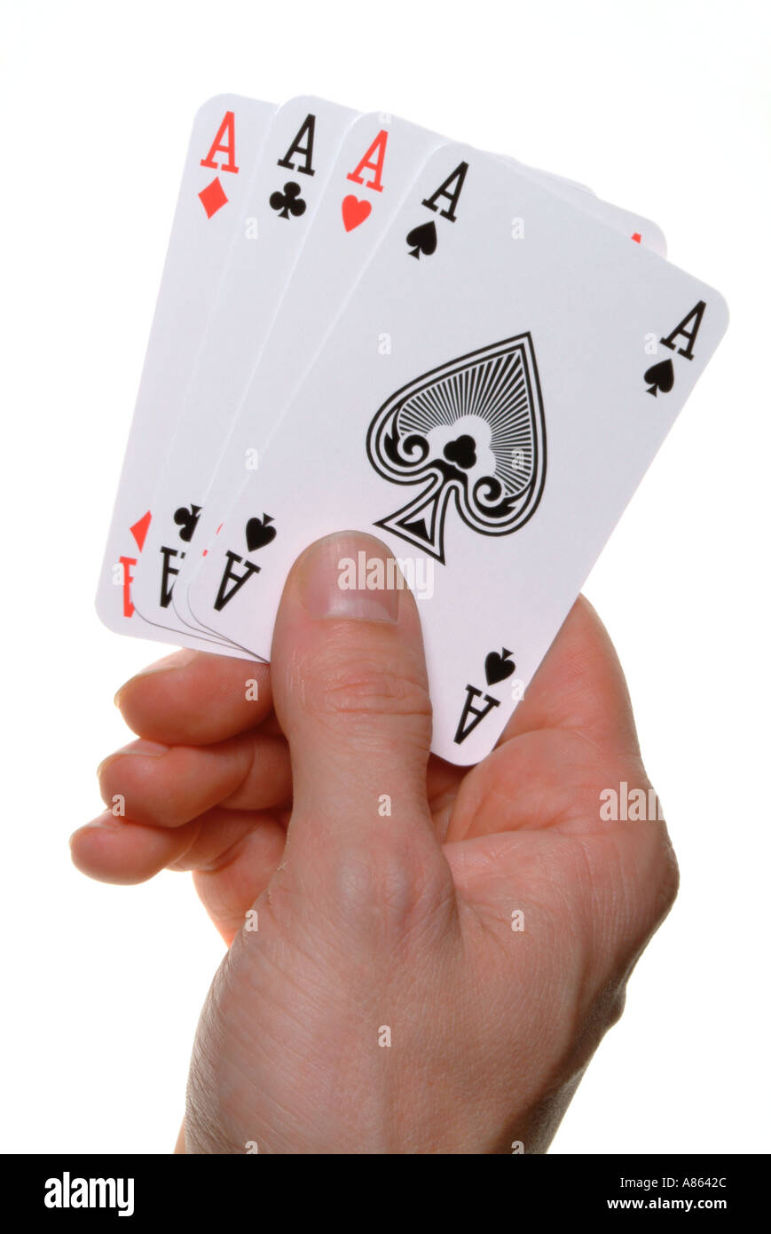 mans hand holding four ace playing cards Stock Photo - Alamy