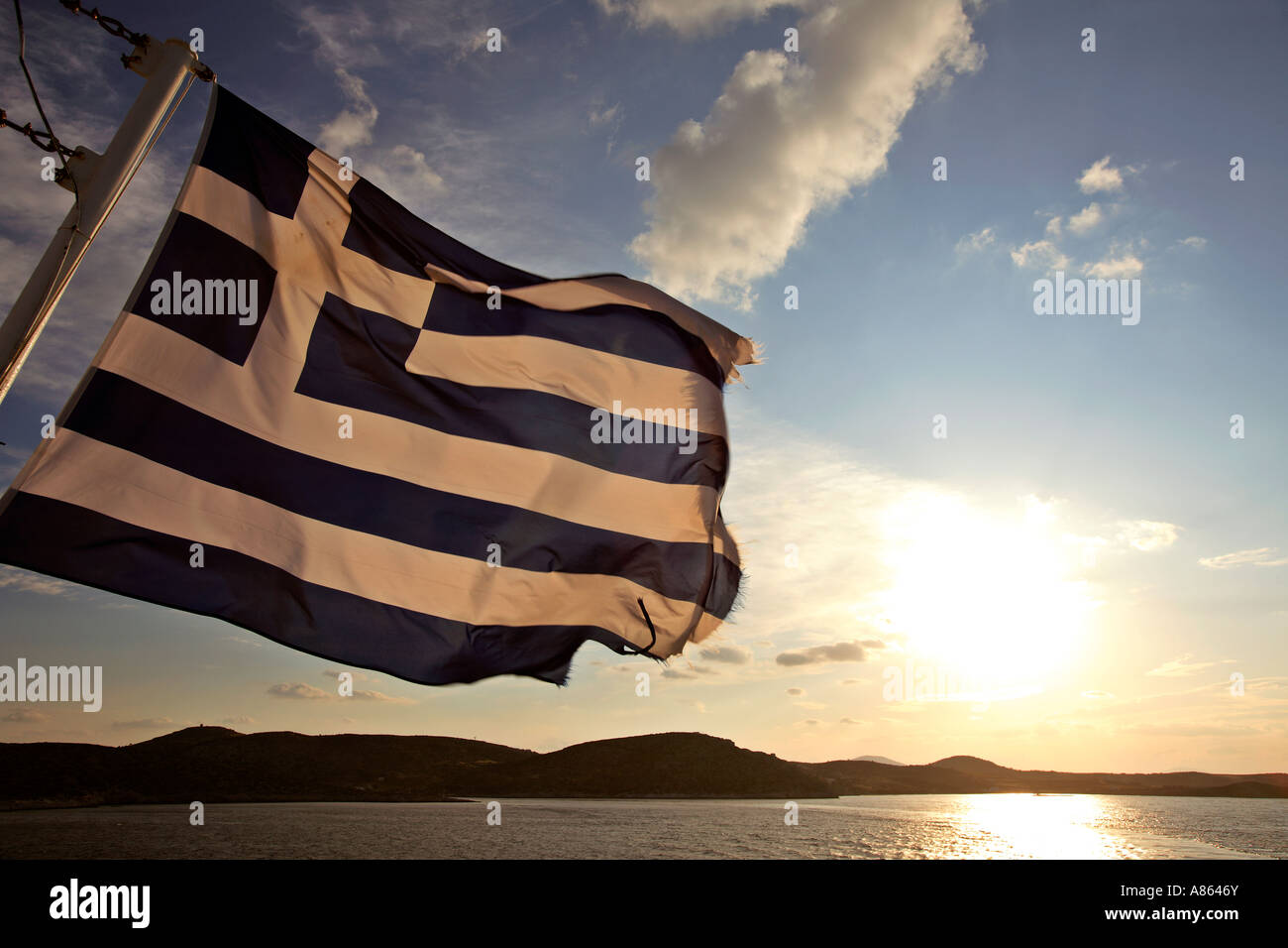 GREECE CYCLADES AMORGOS ISLAND GREEK FLAG BILLOWING IN THE WIND ON THE ...