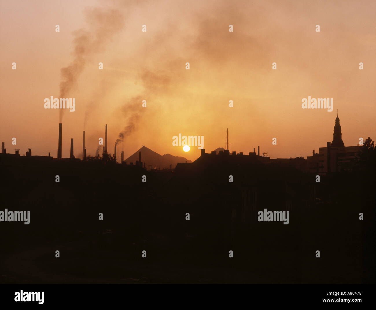 Steel factory at sunset Stock Photo - Alamy