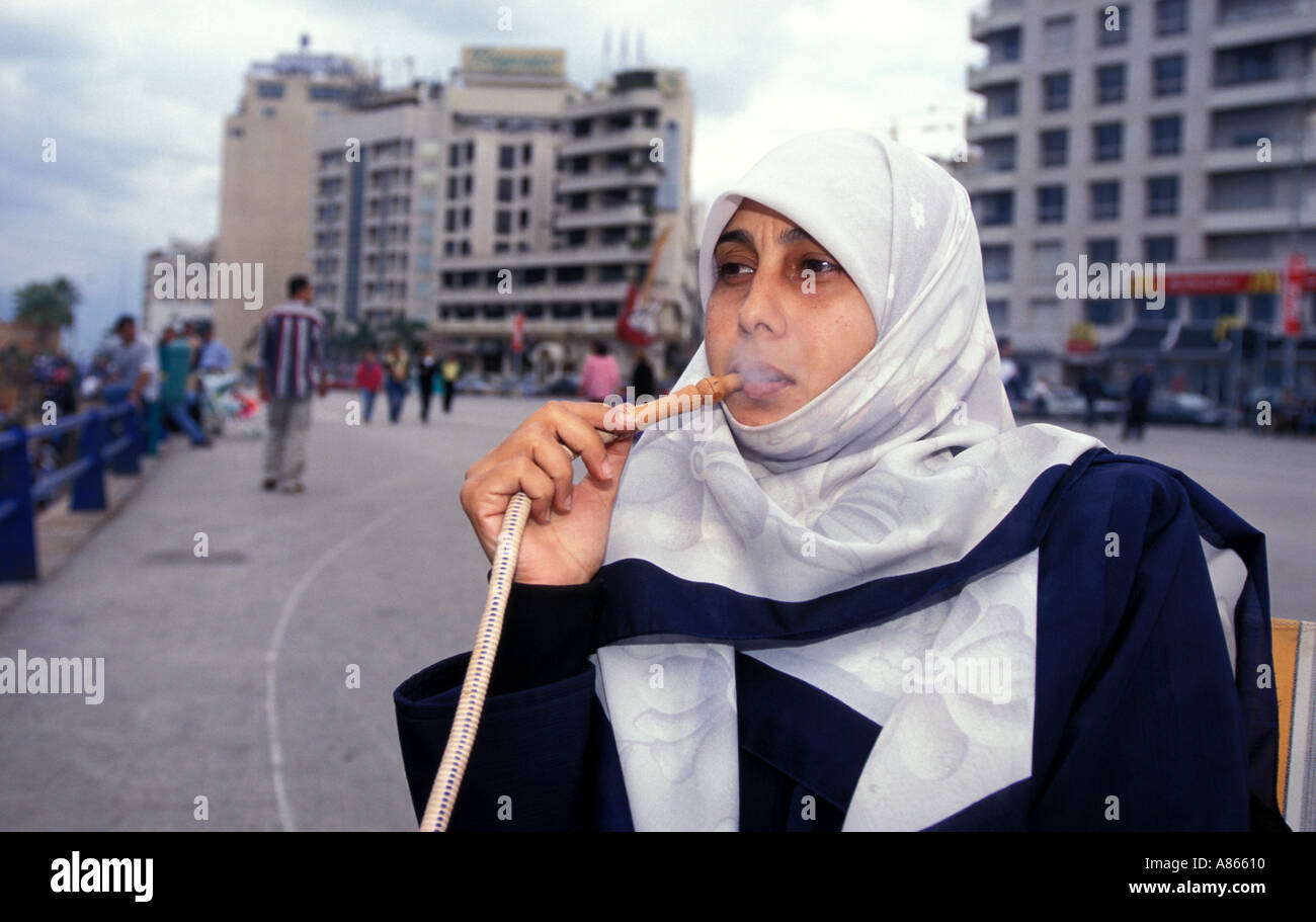 Shi ite Muslim woman smoking Nargileh (aka sheesha, argileh, hubble ...
