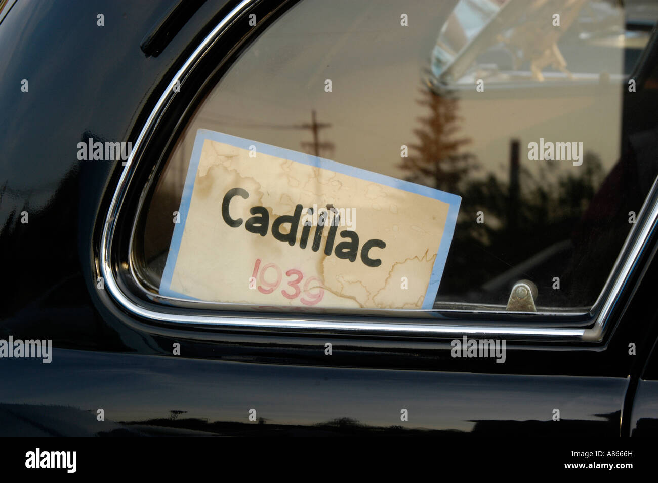 1939 Cadillac sign in window Stock Photo - Alamy