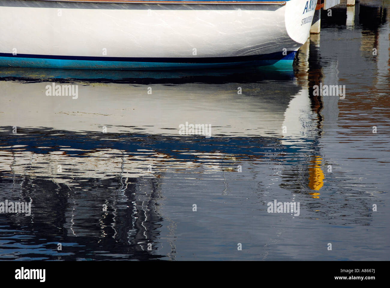 Sailboat's hull reflected in water Stock Photo - Alamy