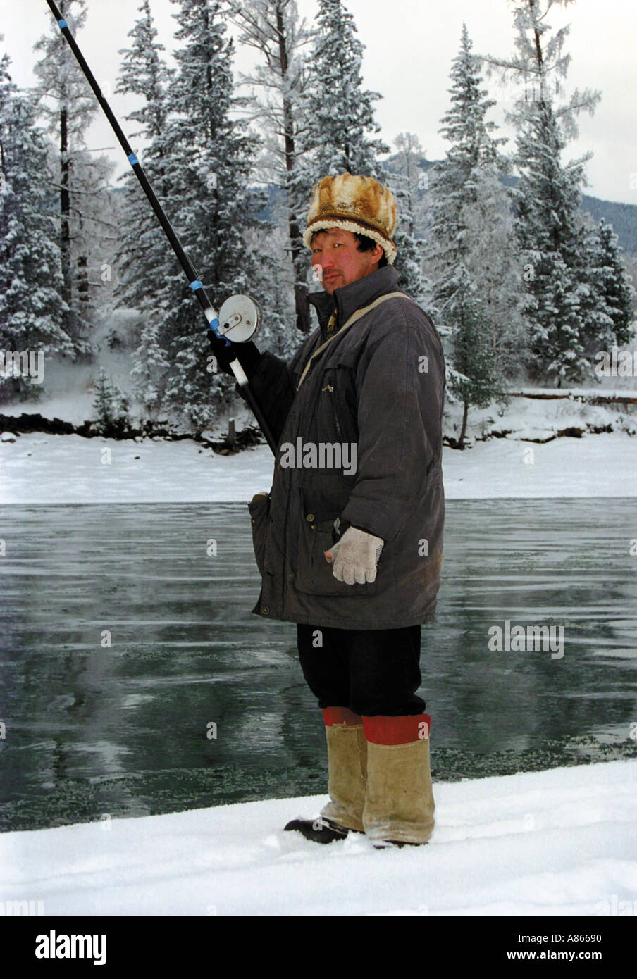 Altai native man is fishing Stock Photo - Alamy
