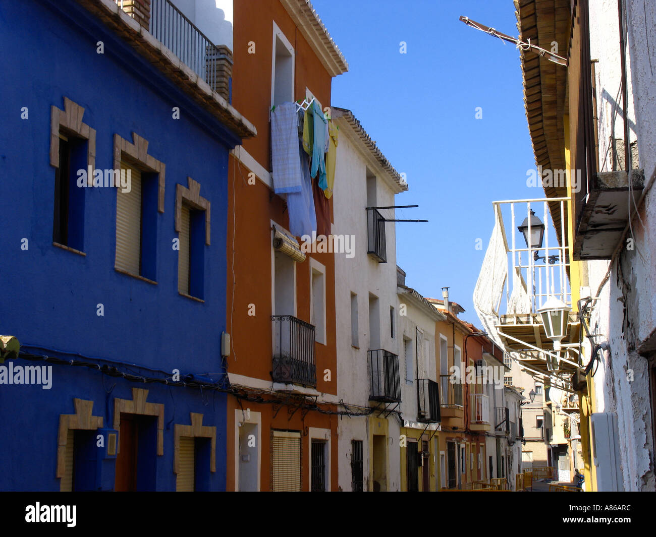 Villagestreet with colourful mediterranean houses in Spain Stock Photo ...