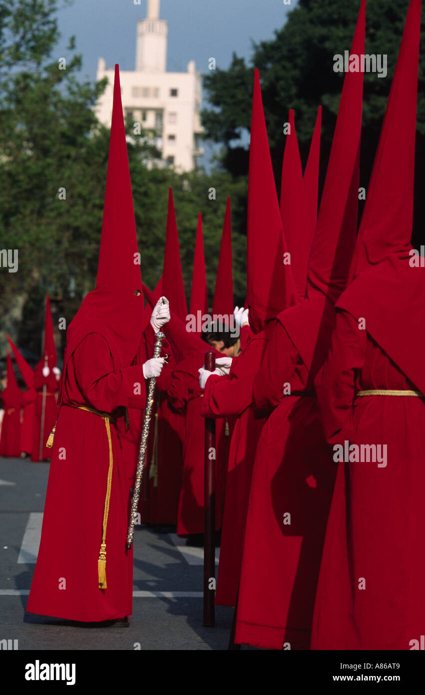 A row of red hooded men in Easter procession in Spain Stock Photo - Alamy