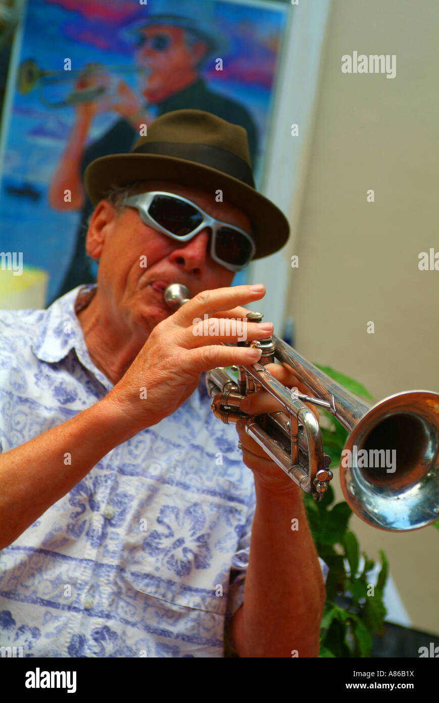 A street performer plays a trumpet outside the Mel Fisher Museum Key ...