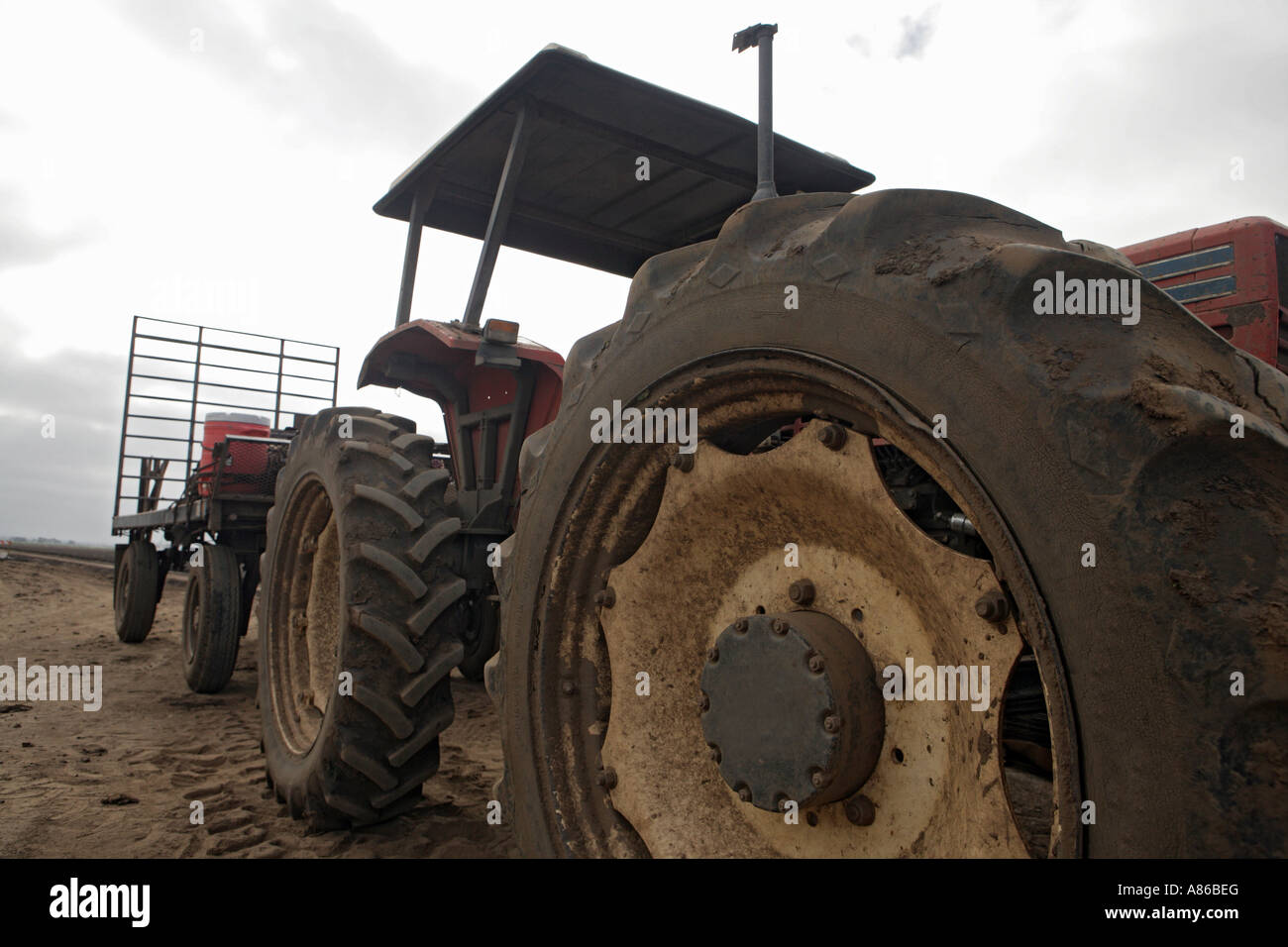 View of two tractor parked on a field Stock Photo - Alamy