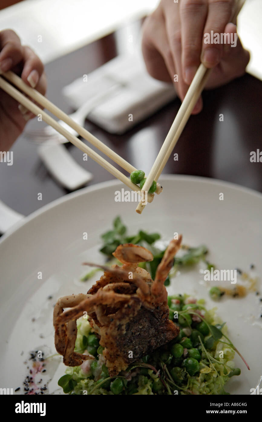 hands holding chopsticks, close up Stock Photo - Alamy