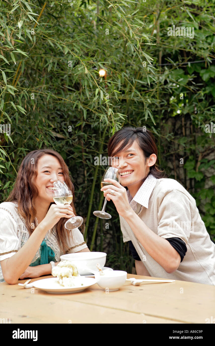 Young couple dinking, side view Stock Photo - Alamy