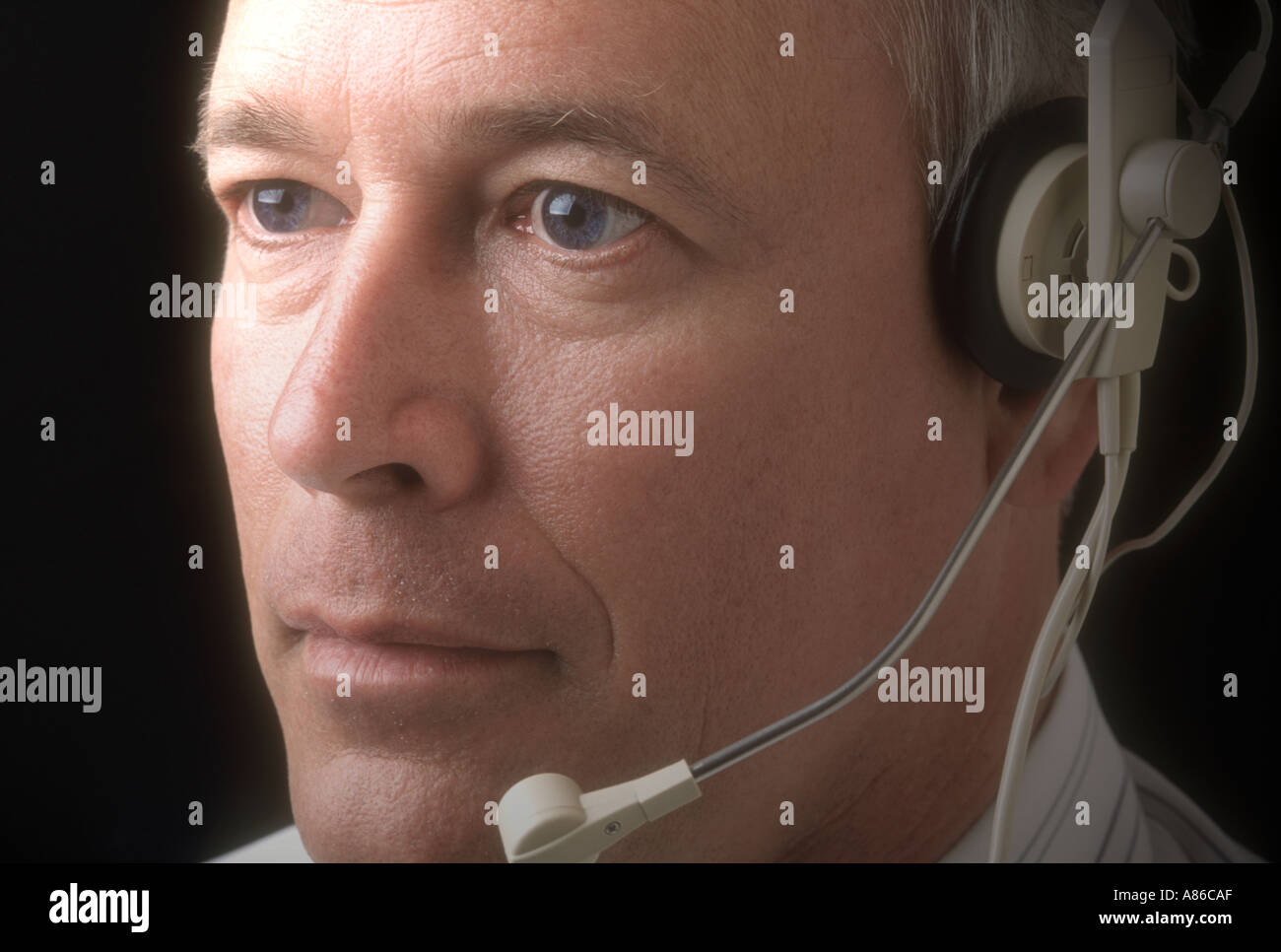 male switchboard operator with headset Stock Photo - Alamy