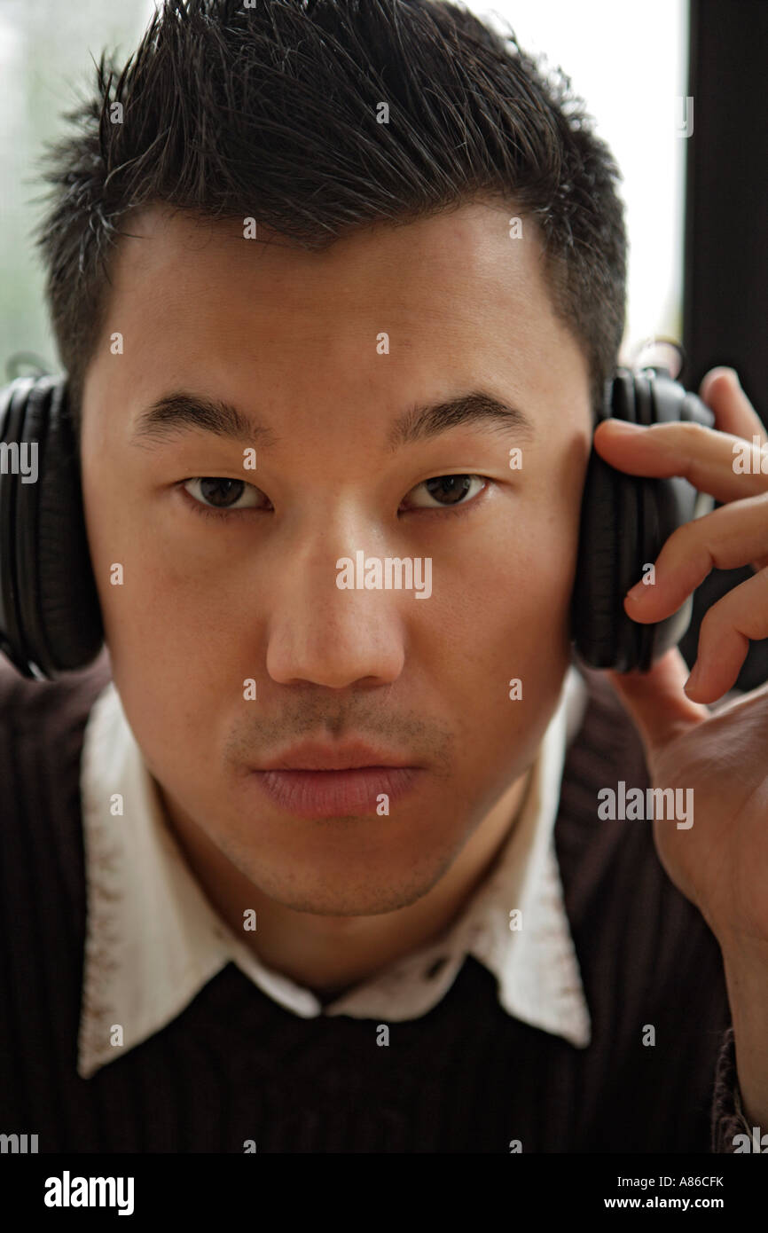 One young man listening music, portrait Stock Photo - Alamy