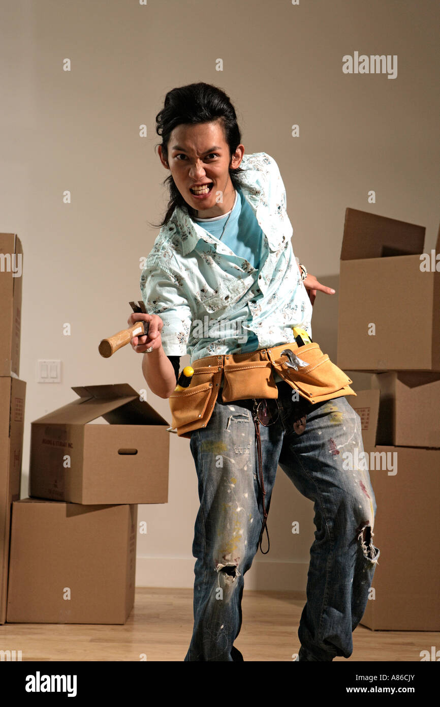 Man holding hammer, portrait Stock Photo - Alamy