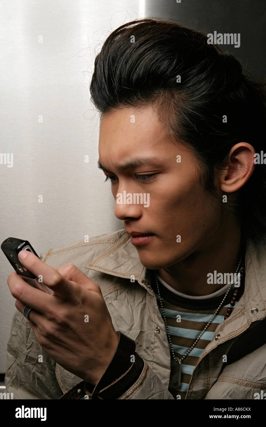 Man holding mobile phone, close-up Stock Photo - Alamy