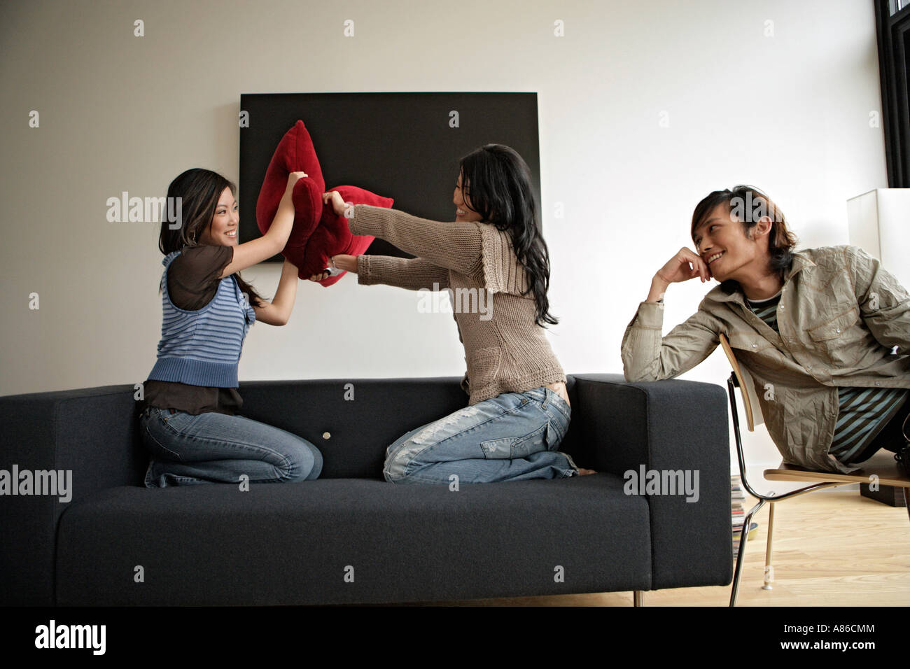 Friends in playful mood, side view Stock Photo - Alamy