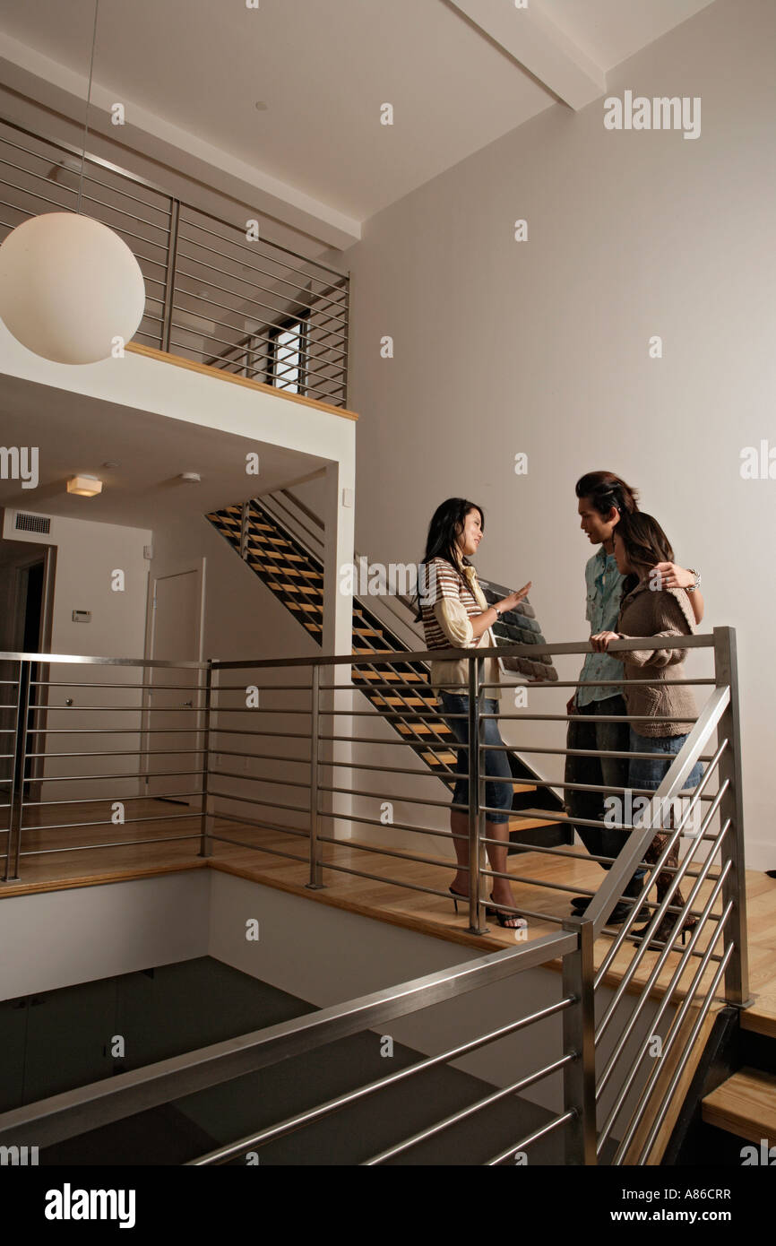 Conversation between three friends, full length Stock Photo - Alamy