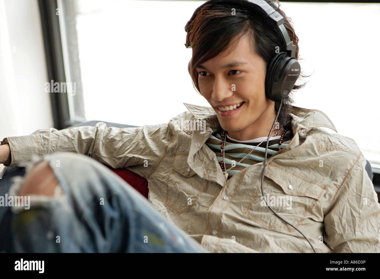 Young man listening to music, portrait Stock Photo - Alamy