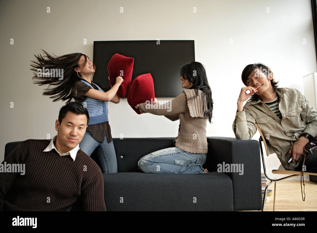 Friends in playful mood, side view Stock Photo - Alamy