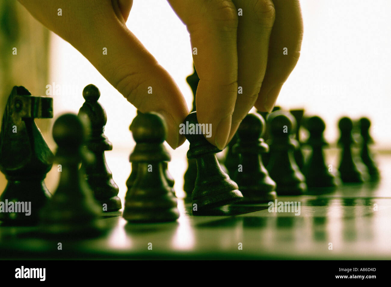 Hand making first chess move hi-res stock photography and images - Alamy