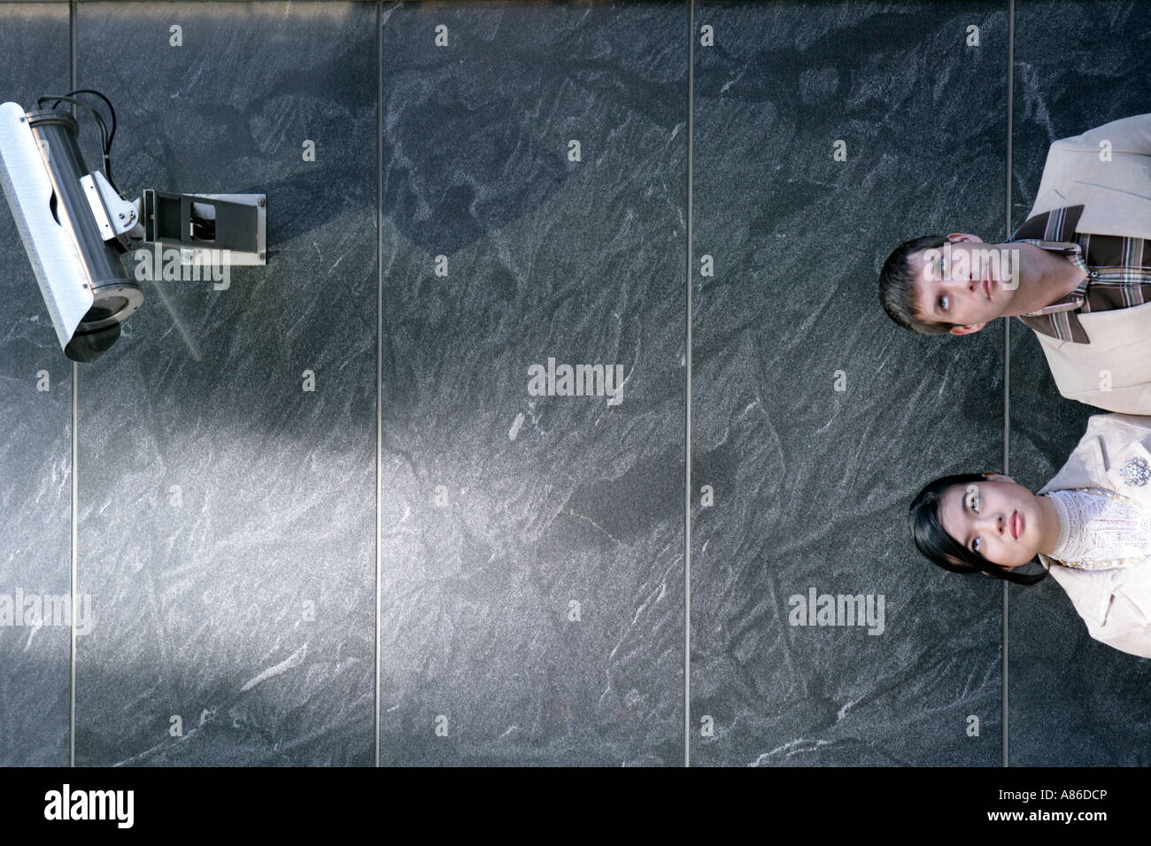 Two people aware of surveillance camera Stock Photo - Alamy