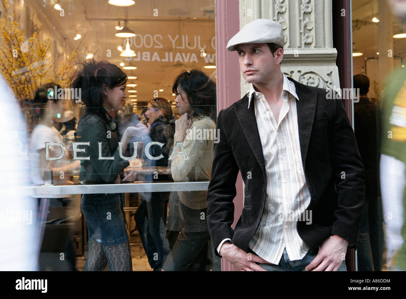 Man leaning on a building Stock Photo - Alamy