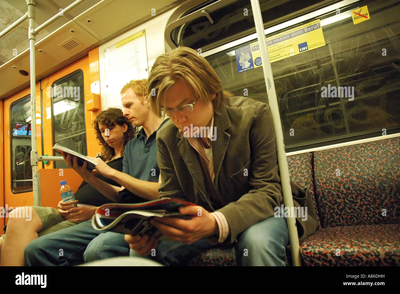 Reading in Berlin metro Berlin Germany Stock Photo - Alamy