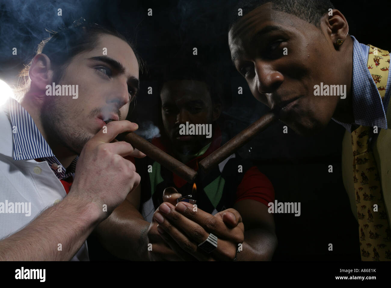 Three young men smoking Stock Photo - Alamy
