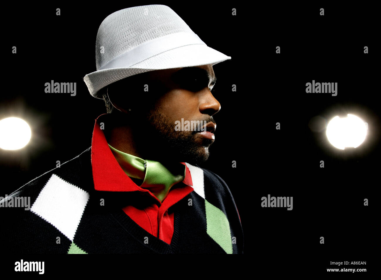 Side view of a young man wearing a stylish hat Stock Photo - Alamy