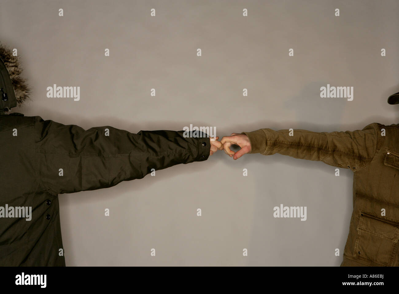 Two people touching hands Stock Photo - Alamy