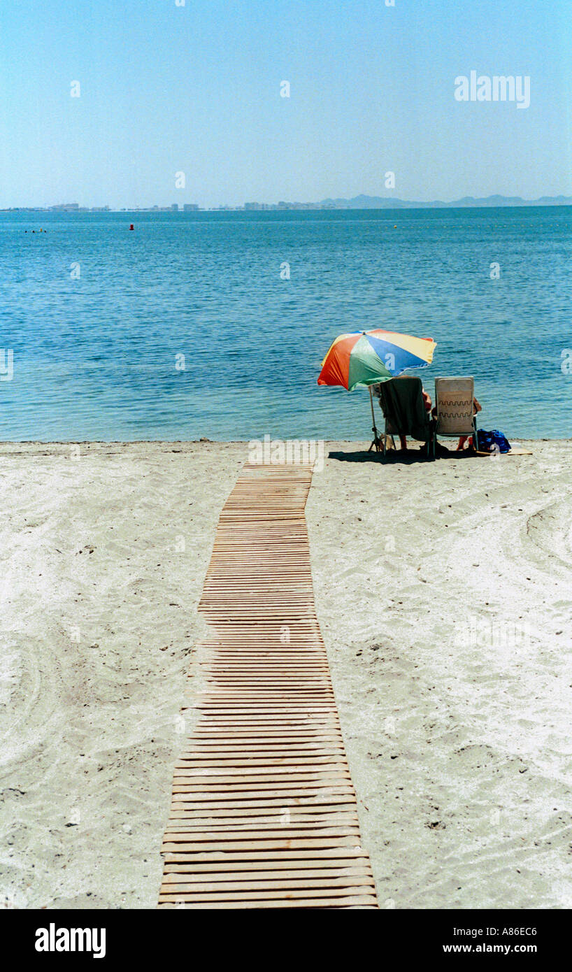 Beach Umbrella in a High Wind Stock Photo - Alamy
