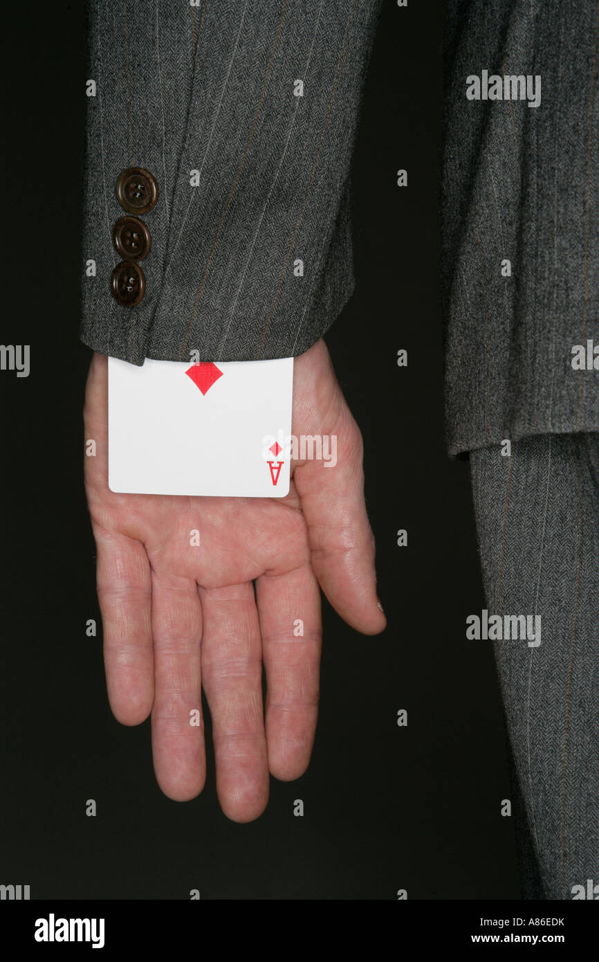 Businessman with playing card under his sleeve Stock Photo - Alamy