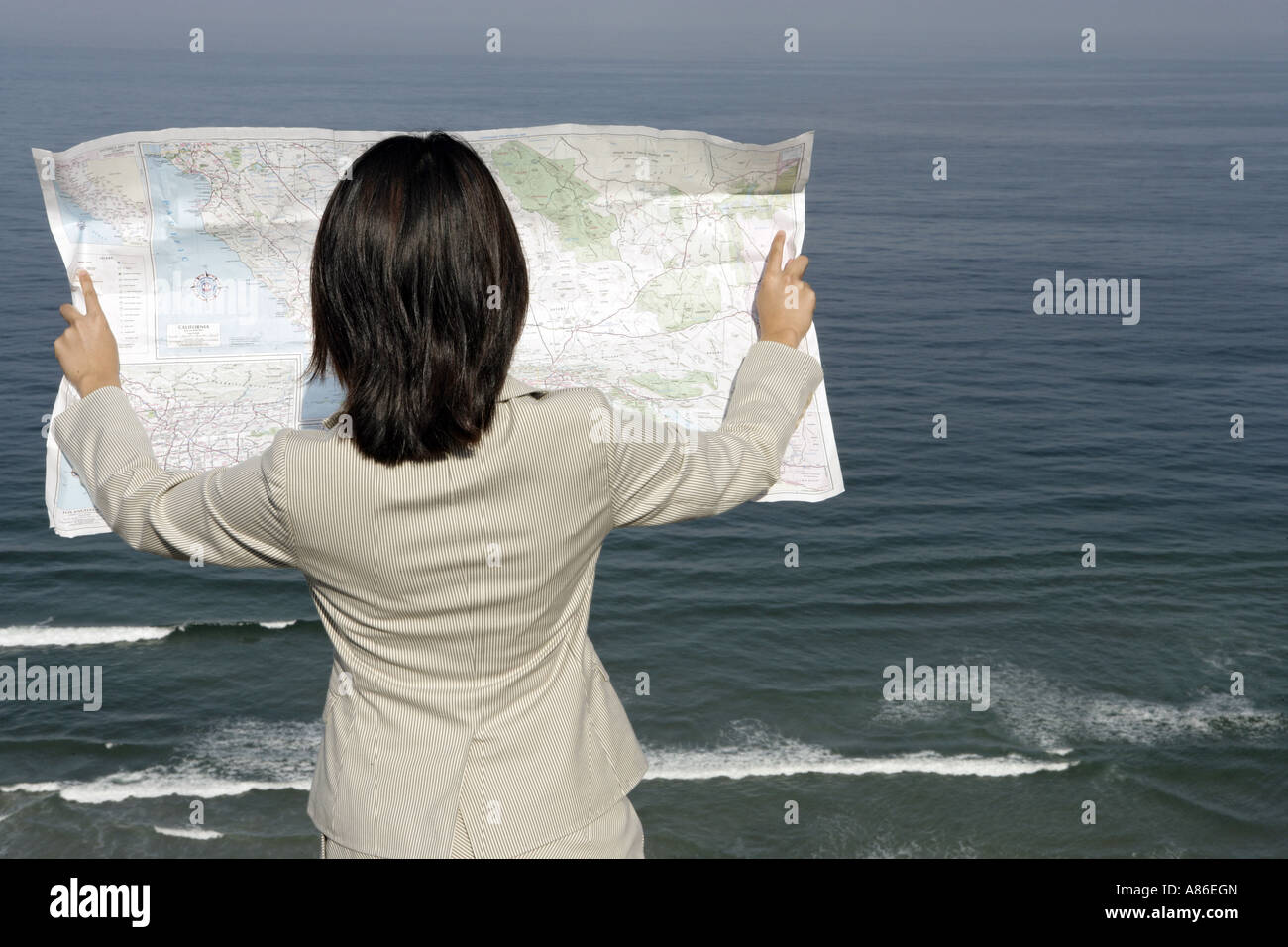 View of a woman reading a map Stock Photo - Alamy