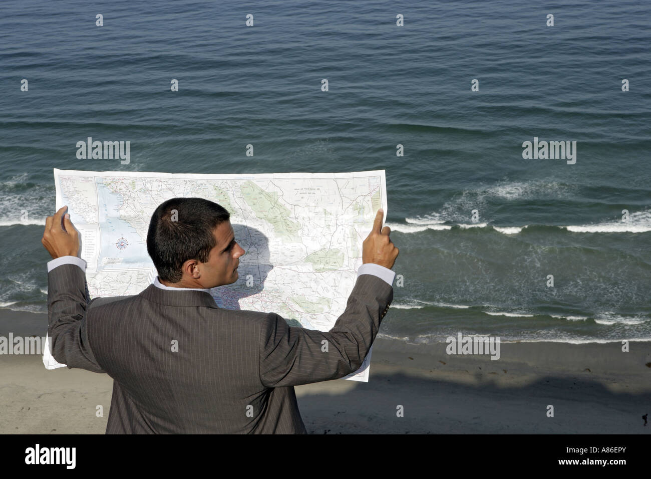 View of a man reading a map Stock Photo - Alamy