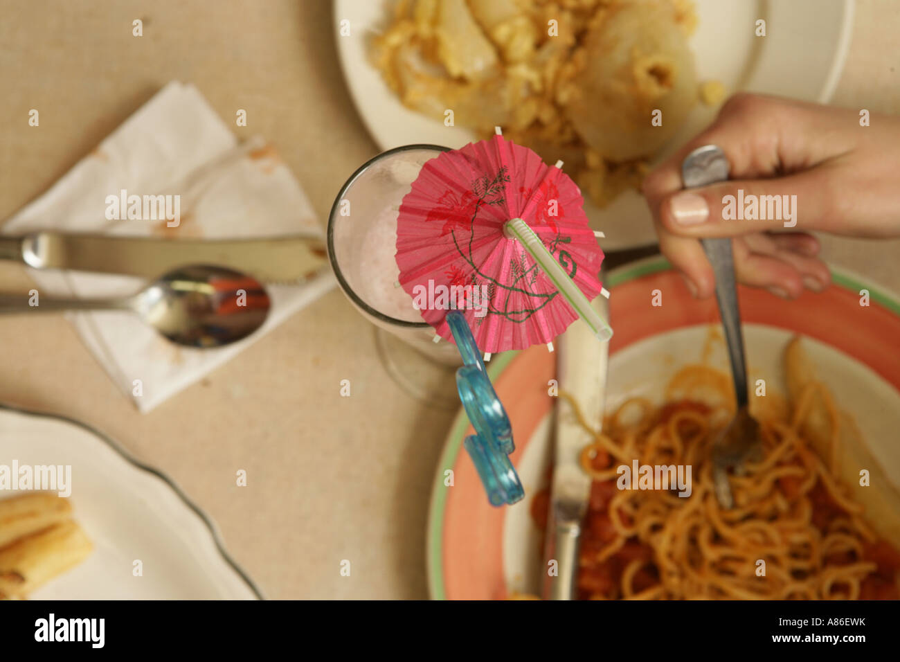 Person eating food in restaurant, close-up Stock Photo - Alamy