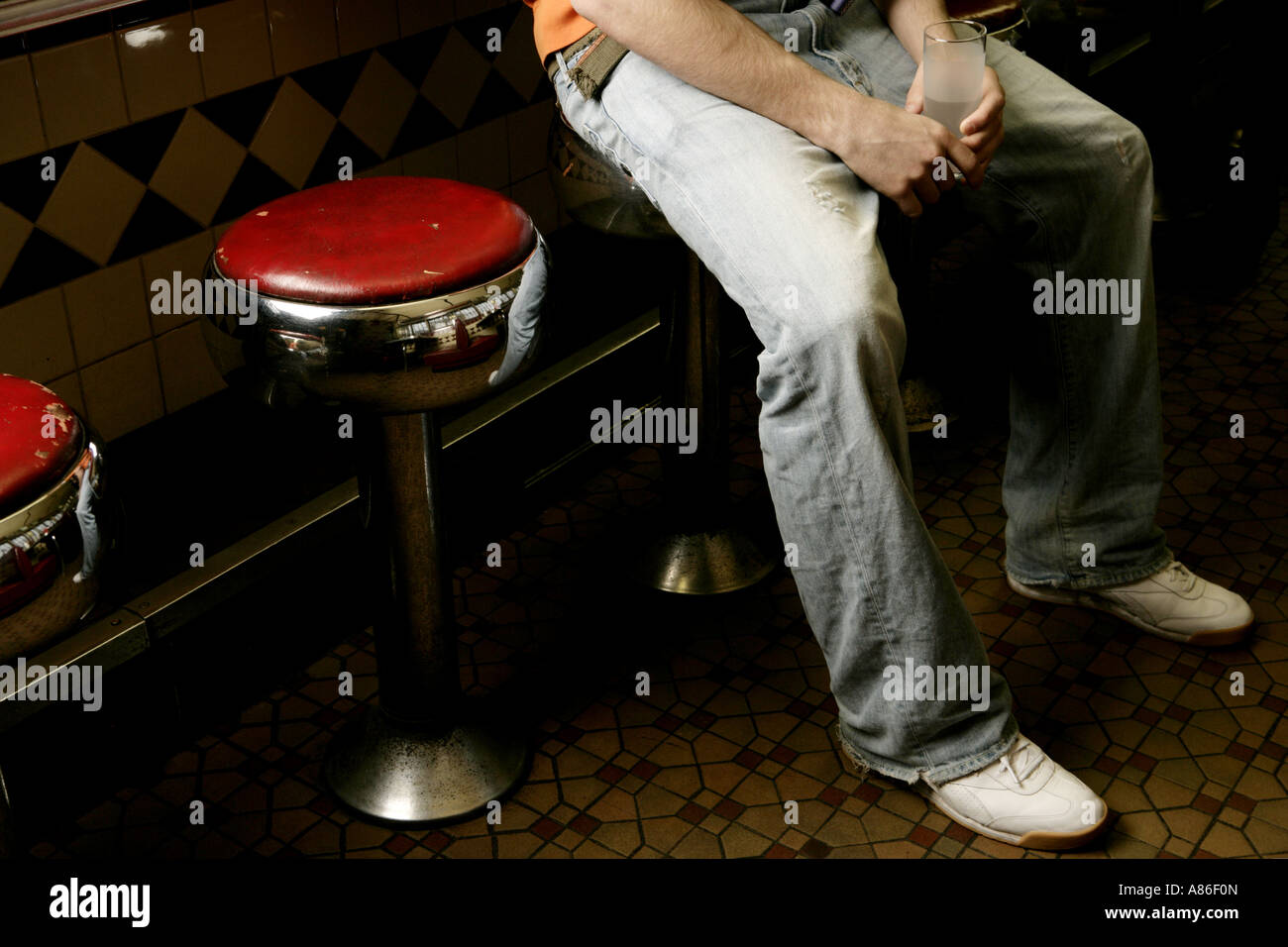 Man sits cafe holding hi-res stock photography and images - Alamy