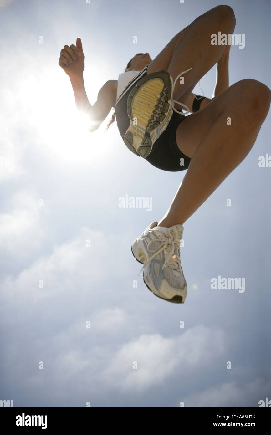 View of a woman jumping Stock Photo - Alamy