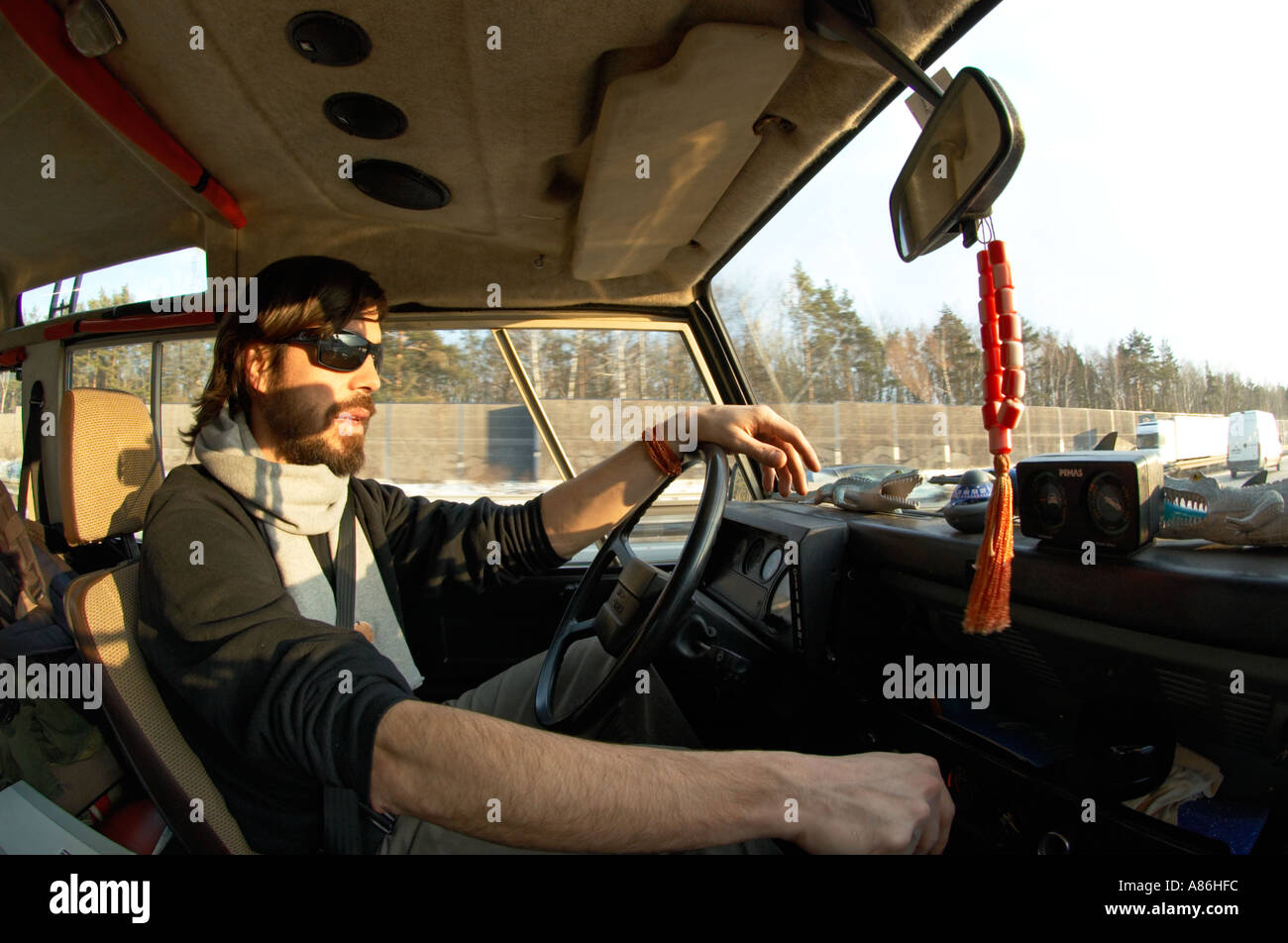 Cool man driving a Land Rover Defender 110 on a motorway RIGHTS ...
