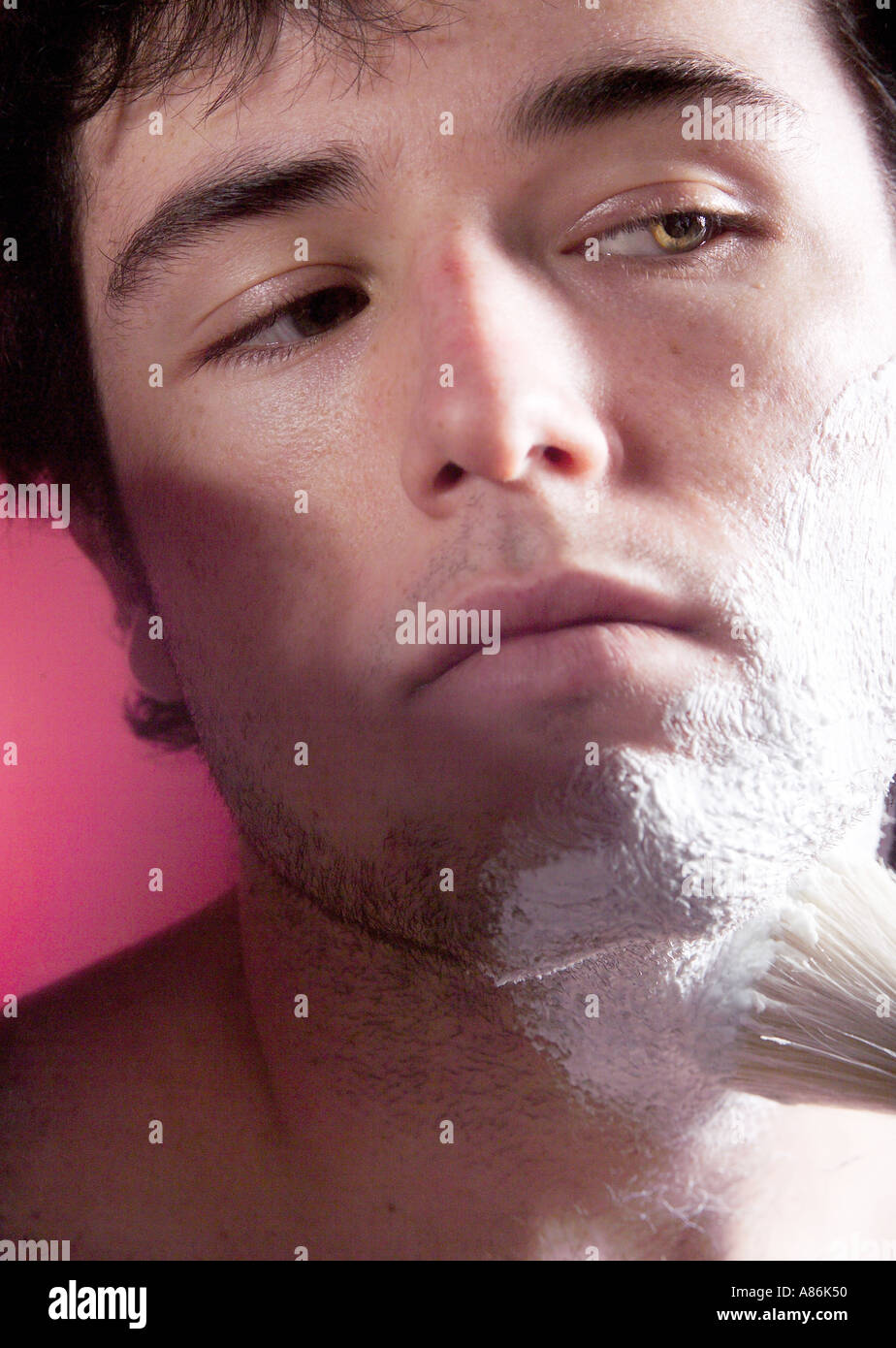 Young handsome Caucasian male model poses shaving Stock Photo - Alamy