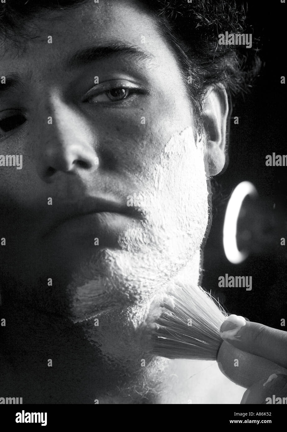 Young handsome Caucasian male model poses shaving Stock Photo - Alamy