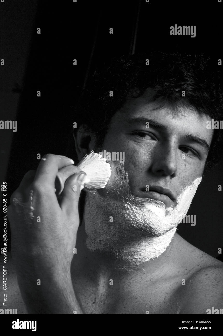 Young handsome Caucasian male model poses shaving Stock Photo - Alamy