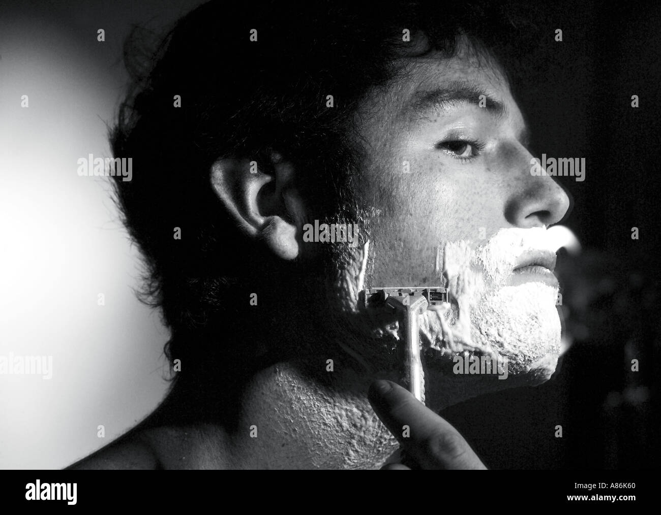 Young handsome Caucasian male model poses shaving Stock Photo - Alamy