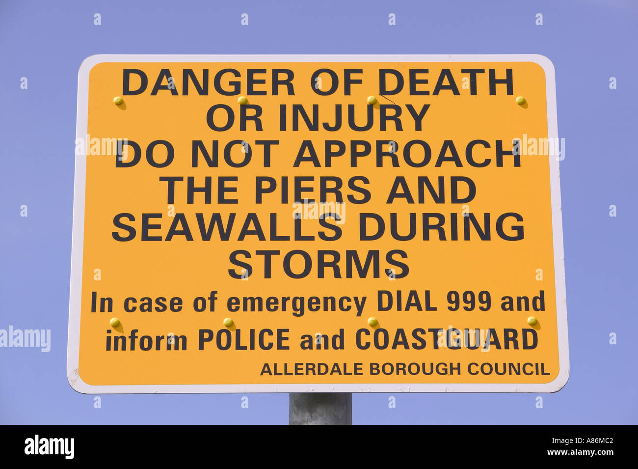 Warning sign on the coast danger on the foreshore during storms Stock ...