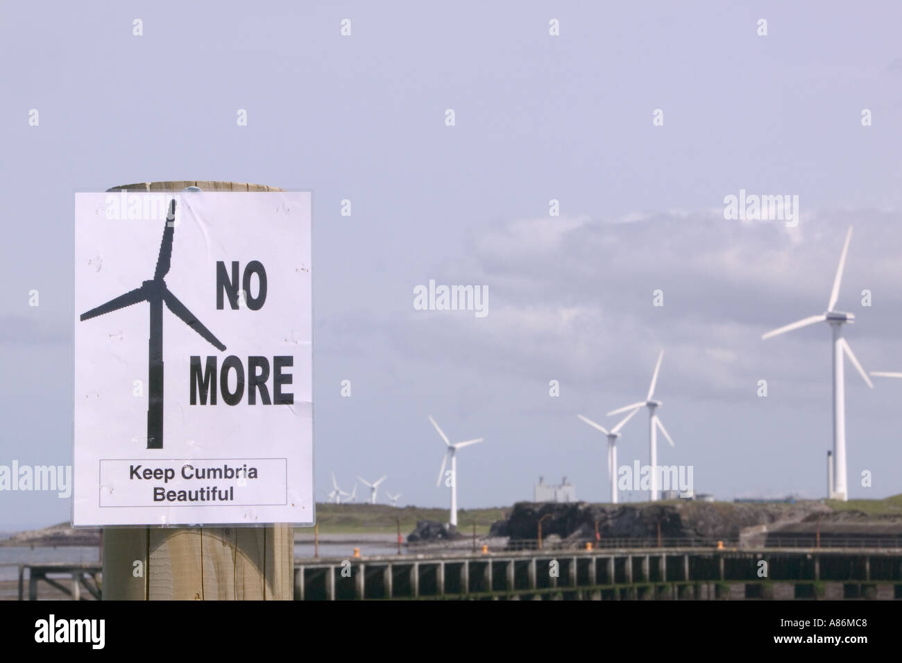 Anti windfarm protest sign in front of a windfarm in Workington Cumbria ...