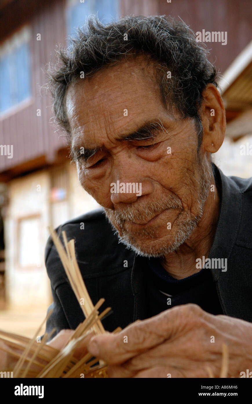 Hmong man basket making Central Laos Stock Photo - Alamy