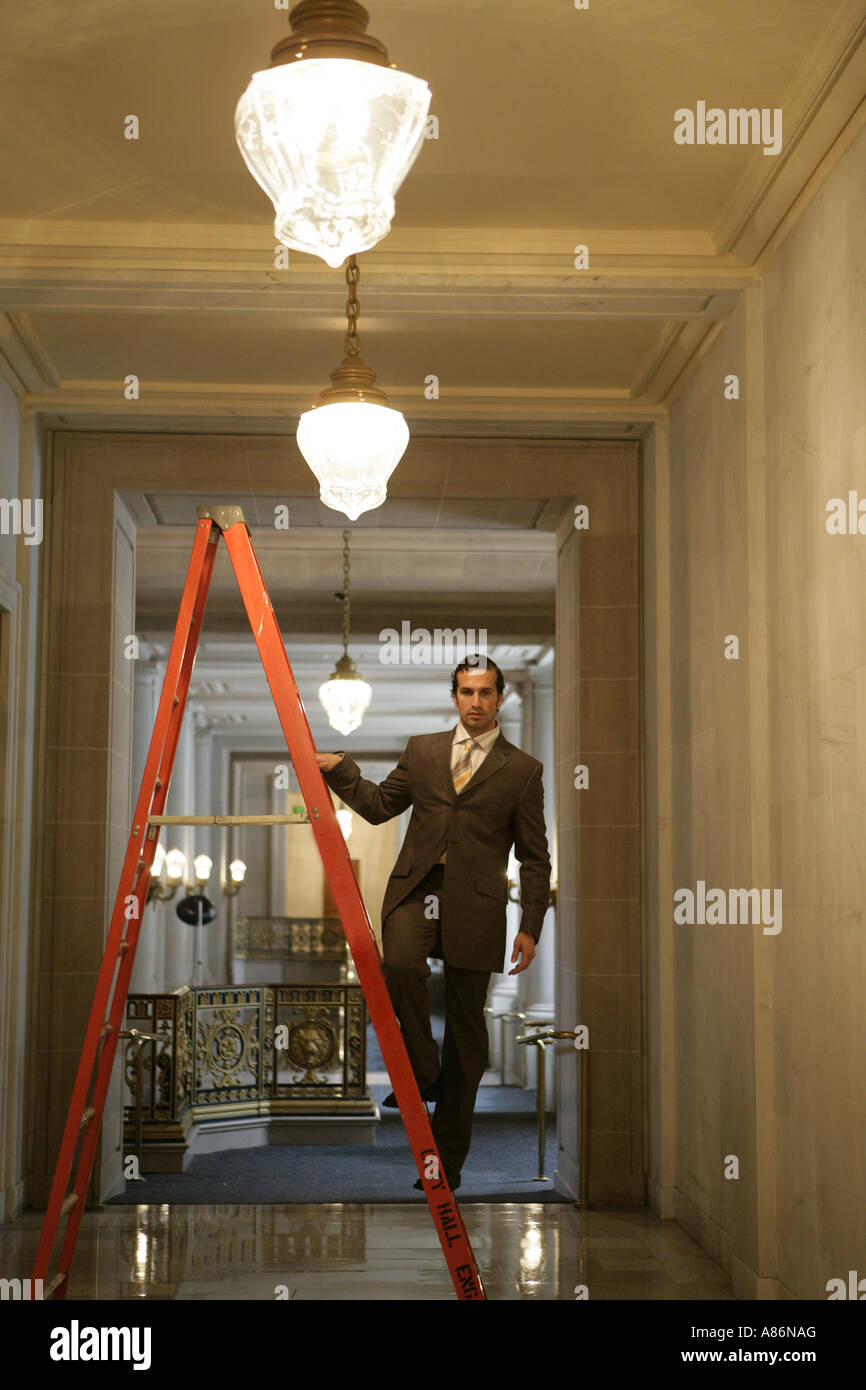 Holding ladder colleague hi-res stock photography and images - Alamy