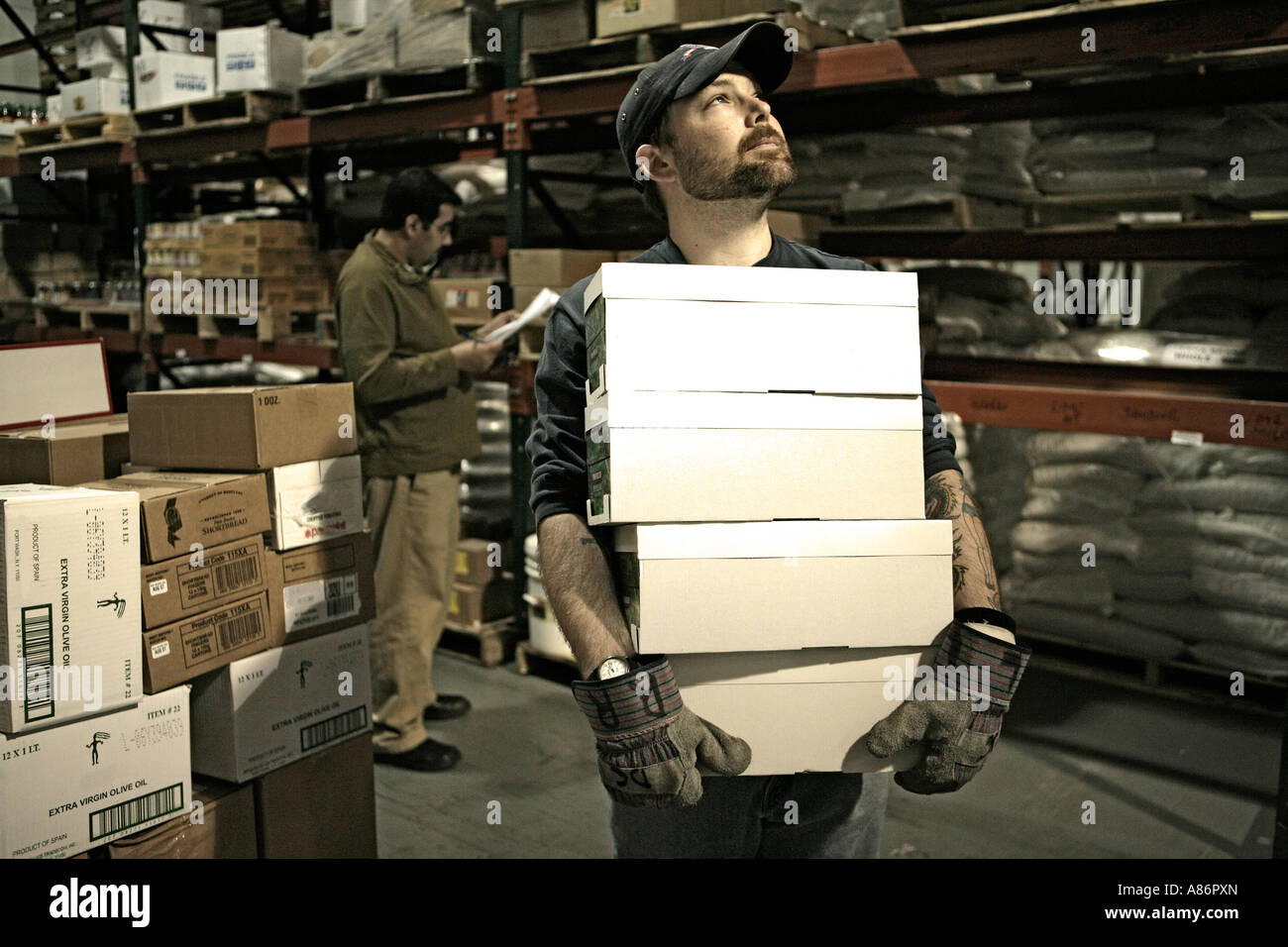 Warehouse employees carrying boxes hi-res stock photography and images ...