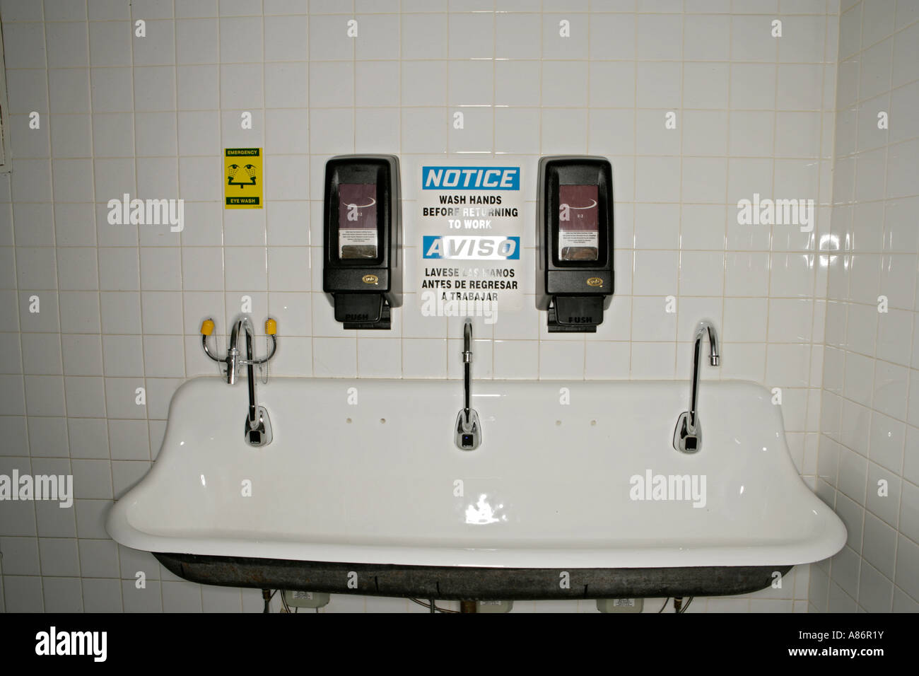 View of a sink and dispensers Stock Photo - Alamy