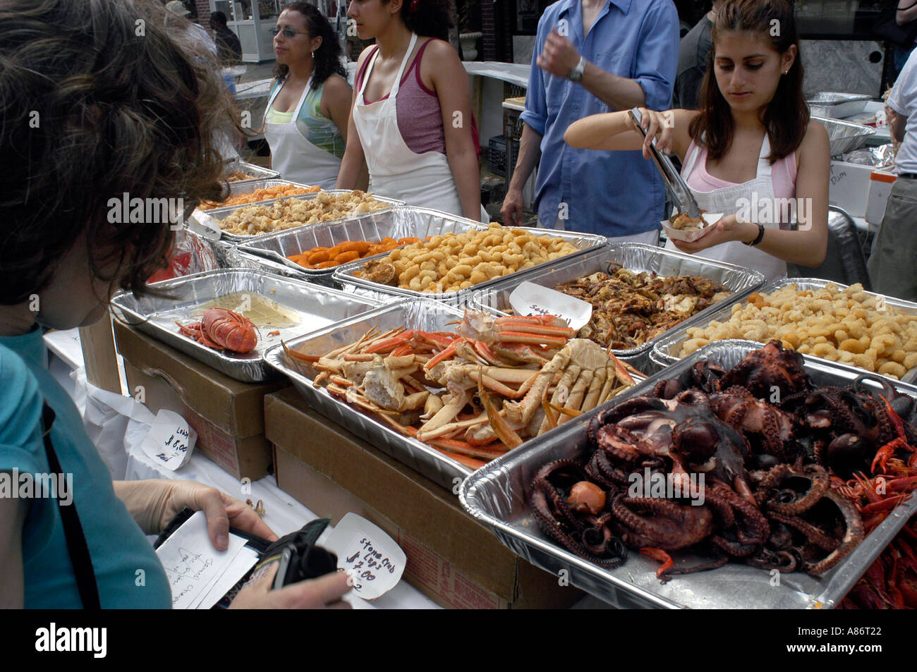 A stand selling fried fish at the Ninth Avenue Food Festival Stock ...