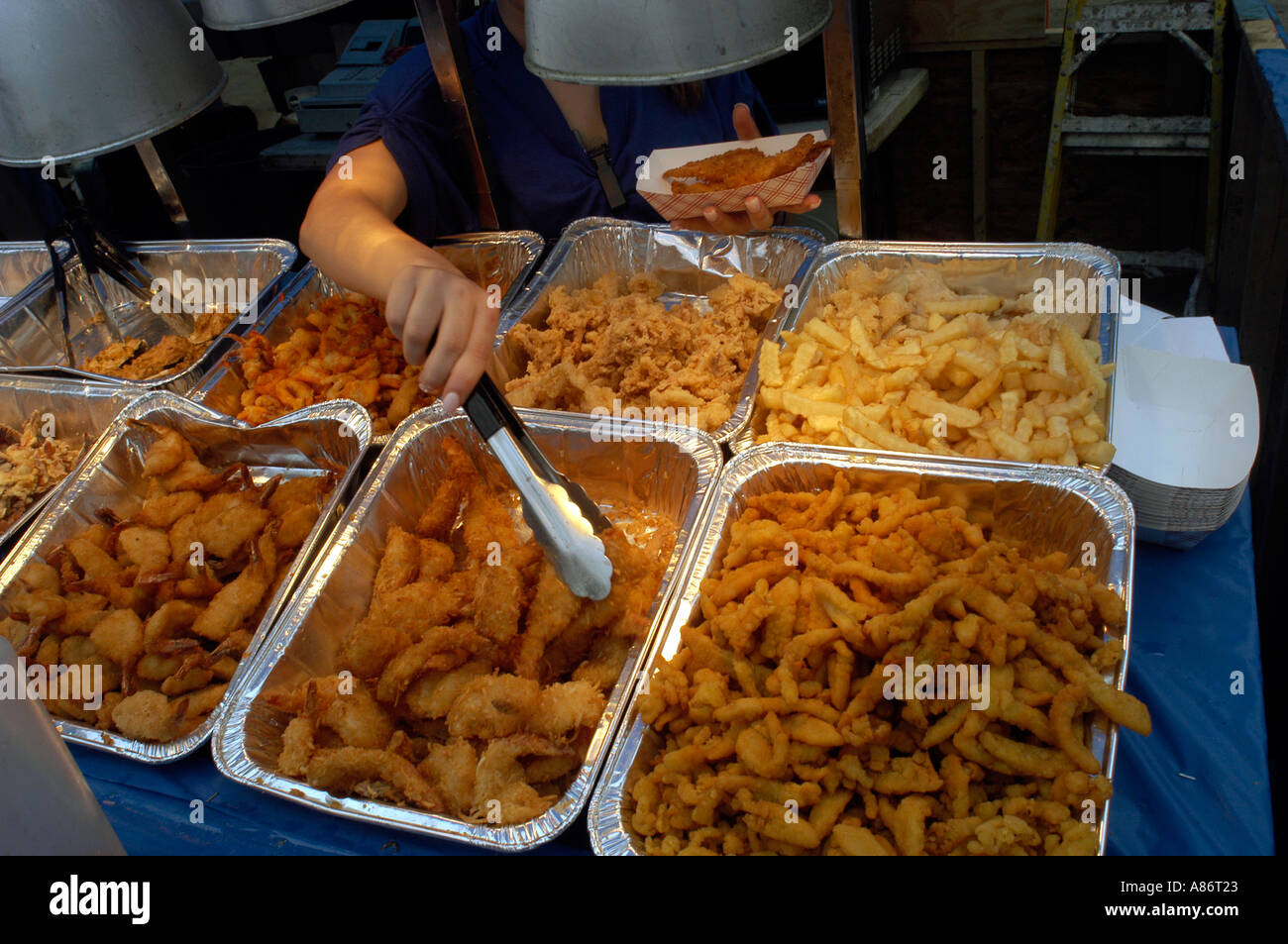 A stand selling fried fish at the Ninth Avenue Food Festival Stock ...
