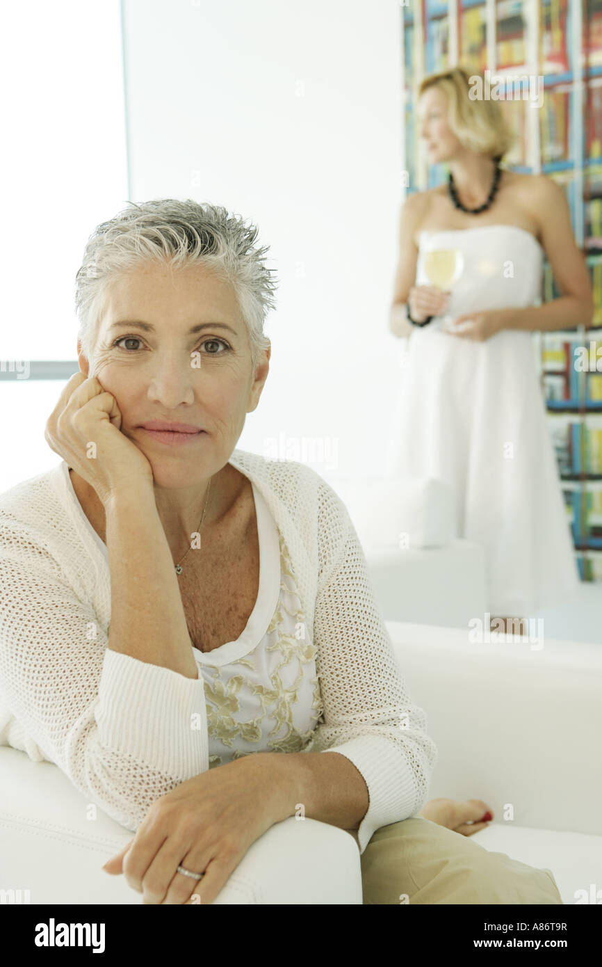 Two women inside a living room Stock Photo - Alamy